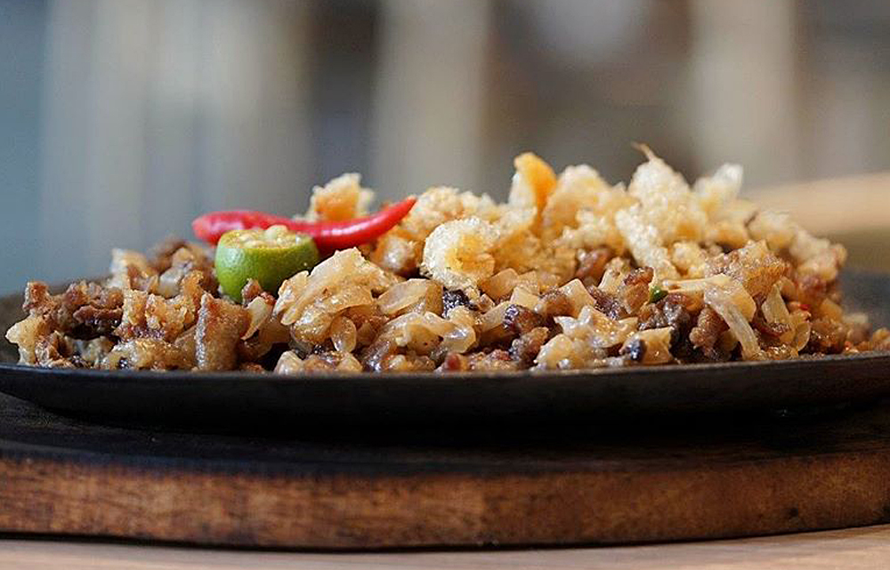 Sisig In Manam Comfort Food | TasteAtlas | Recommended authentic ...