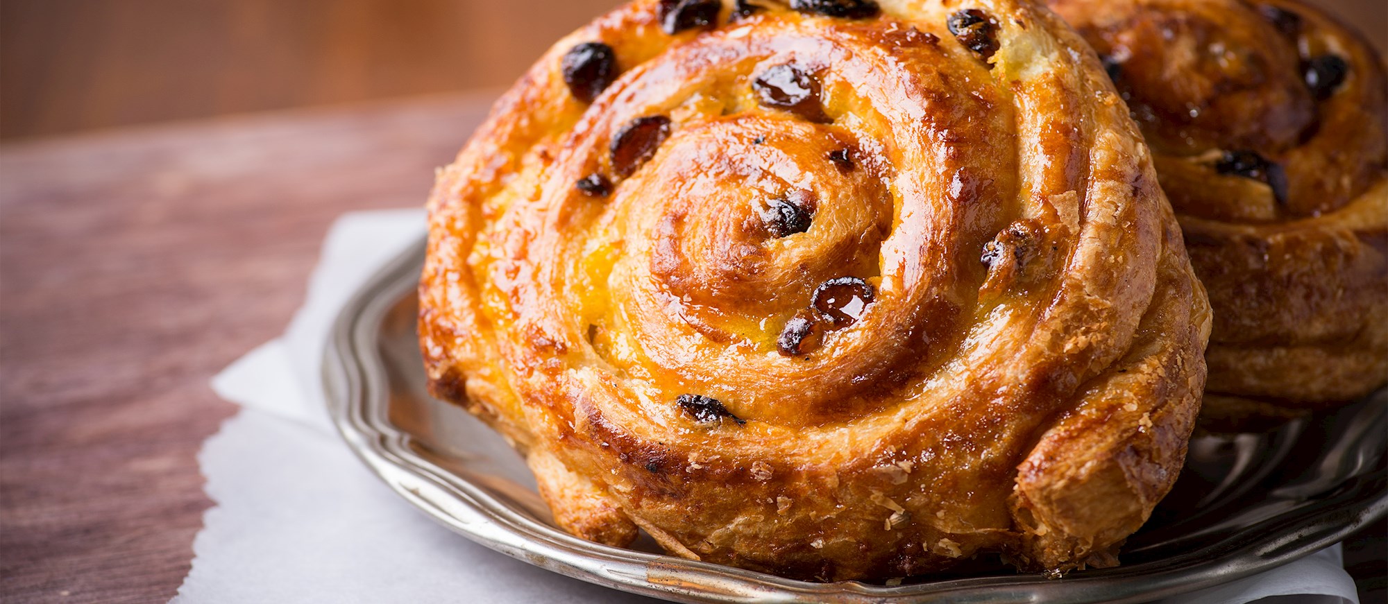 Where to Eat the Best Pain Aux Raisins in the World? | TasteAtlas