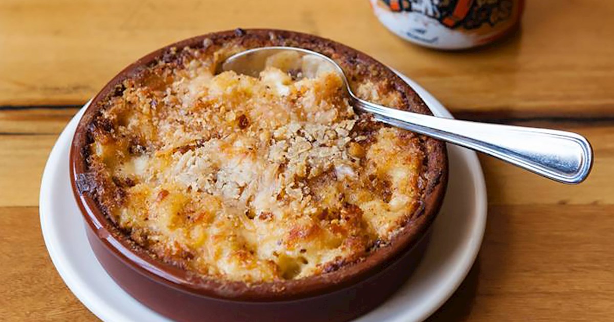 Mac And Cheese In Blue Plate | TasteAtlas | Recommended authentic ...