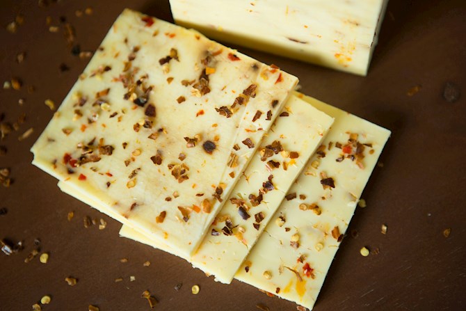 Saputo Dairy UK Hatch Pepper Cheddar - Best Gourmet Products | TasteAtlas